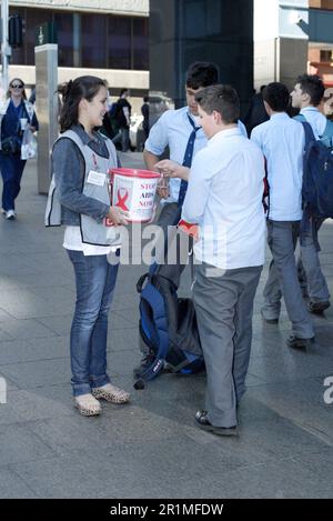A collector seeks public donations for the Aids Trust of Australia on ...