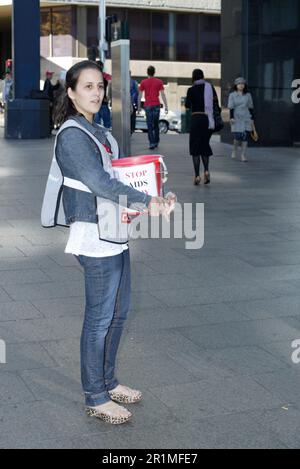 A collector seeks public donations for the Aids Trust of Australia on ...