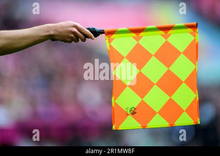 The linesman holds the offside flag Stock Photo - Alamy