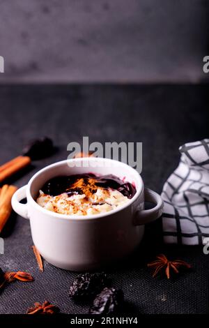 A typical Peruvian dessert with rice pudding and purple mazamorra Stock ...