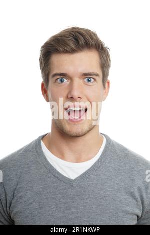 Handsome young man happy and surprised cheering expressing wow gesture ...