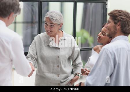 Conversation between managers and employees in the office Stock Photo ...