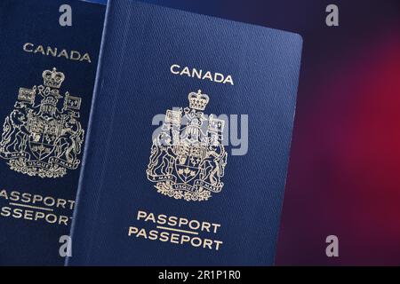 Composition with two Canadian passports Stock Photo - Alamy