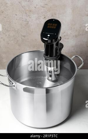 Thermal immersion circulator in pot isolated on white, top view. Sous ...