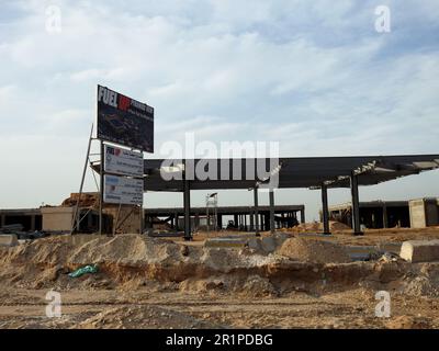 Giza, Egypt, May 4 2023: Fuel up gas and oil station under construction ...