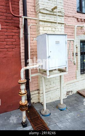 Gas entry point to a residential building. Gas pipes with valve on the ...