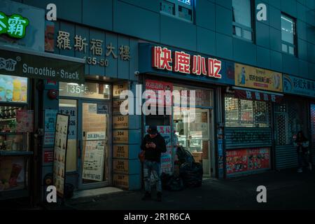Street scene at night in Flushing, Queens, New York City Stock Photo ...