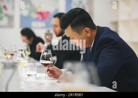 Sommelier school. Studying wine waiter during blind tasting Stock Photo ...