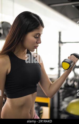 strengthening arm muscles with dumbbells, physical training of fitness ...