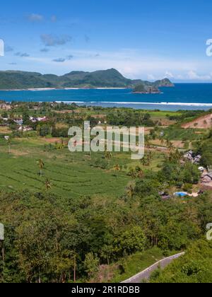 Lush rural landscape with Selong belanak beach in distance, Lombok ...