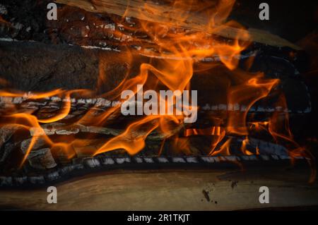 Burning wood smoldering wood smoldering log. Burning logs burned in the ...