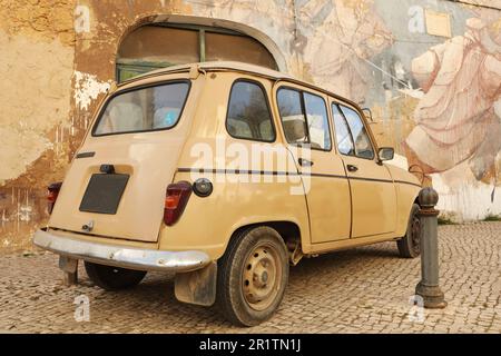 Old Renault car parked in front of a mural, Old Town, Lagos, Algarve ...