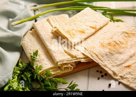 Fresh lavash on white tile background Stock Photo - Alamy