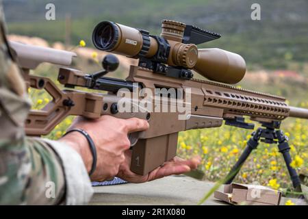 A U.S. Army Soldier reloads his rifle during European Best Sniper Team ...