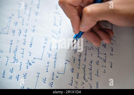 Student writing mathematical calculations on paper, closeup Stock Photo ...