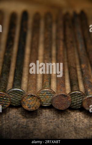 old rusty, 16 penny nail heads, line of heavy penny nails for ...
