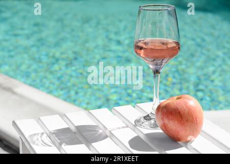 Glass of rose wine by the edge of a swimming pool at a pool party Stock ...
