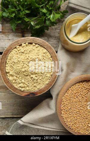 Composition of mustard and mustard seeds on wooden background Stock ...