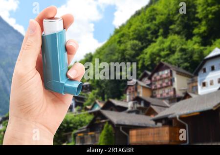 Woman with asthma inhaler in mountains, closeup. Emergency first aid ...