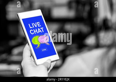 Smartphone screen displaying a live chat concept Stock Photo - Alamy