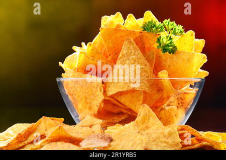 Composition with glass bowl of tortilla chips and dipping sauces Stock ...