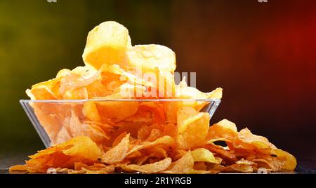 Composition with glass bowl of potato chips and dipping sauces Stock ...
