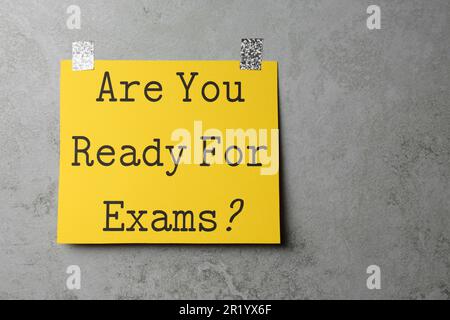 Sheet of paper with question Are You Ready For Exams? on pink ...