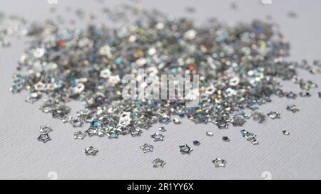 Pile of silver star shaped sequins on white background, closeup Stock ...