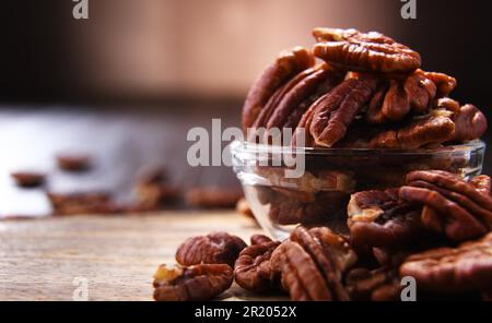 Composition with a bowl of shelled pecan nuts. Delicacies Stock Photo ...