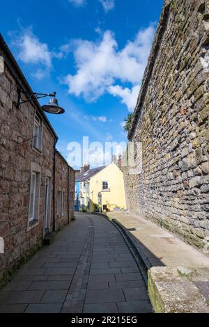 Narrow old street in Caernarfon, Wales with elegant Georgian houses ...
