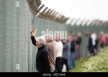 People watch from the perimeter fence as the UK's only airworthy ...