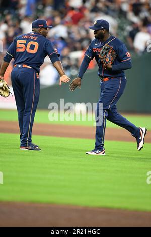 Houston Astros closing pitcher Hector Neris, right, hugs catcher Yainer ...