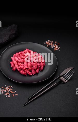 Delicious fusilli pasta with beetroot pesto, parmesan, salt and spices ...