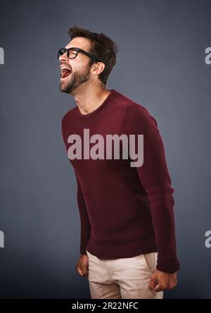 Young man looking frustrated and giving thumbs down at the park Stock ...