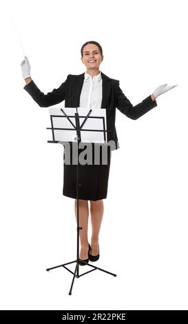 Happy young conductor with baton and note stand on white background ...