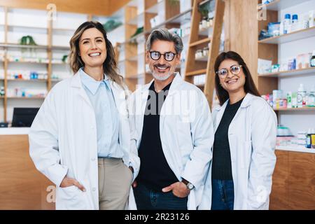 team of pharmacist chemist woman group standing in pharmacy drugstore ...