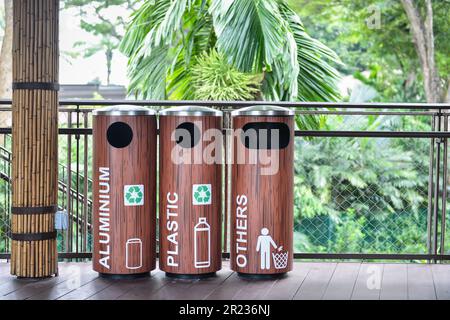Collection of waste bins full of different types of garbage, recycling ...