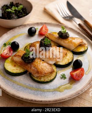Cod steak baked with potato Stock Photo - Alamy