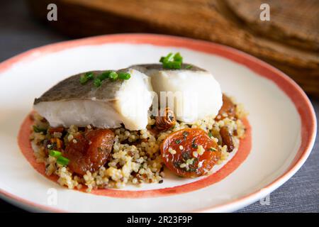 Baked cod with vegetables, nuts and quinoa Stock Photo - Alamy
