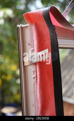 Window tape inside with window frame holder before installation. Vapor barrier tape to cover ...