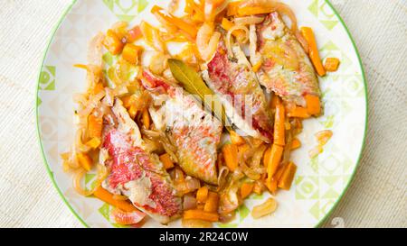 Plate of top quality red mullets cooked in the oven with vegetables in ...