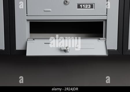 Open empty metal mailbox with keyhole indoors Stock Photo - Alamy