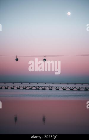 A mesmerizing view of a moon at sunset Stock Photo - Alamy