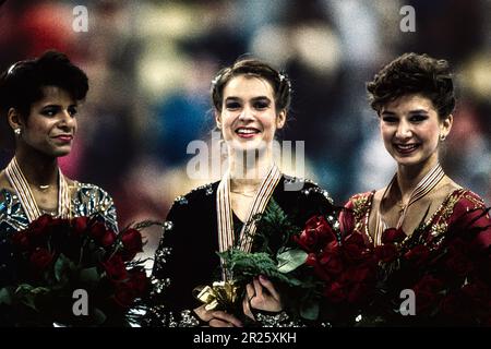 Gold medalist Debi Thomas (C), Silver medalist Jill Trenary (L) and ...