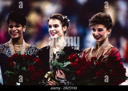 Gold medalist Debi Thomas (C), Silver medalist Jill Trenary (L) and ...