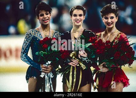 Gold medalist Debi Thomas (C), Silver medalist Jill Trenary (L) and ...