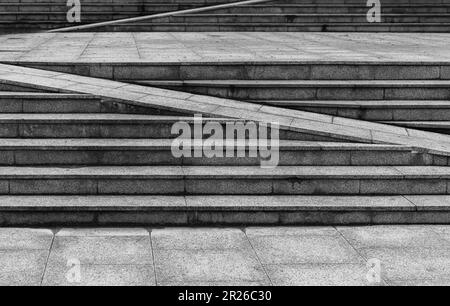 Gray granite stairs with a ramp, abstract outdoor urban architecture ...