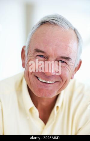 smart friendly looking mature man Stock Photo - Alamy