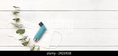 Asthma inhaler with eucalyptus branch on white wooden background Stock ...