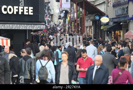 Sunny day in kadikoy and many people going for a walk and the a steamer ...